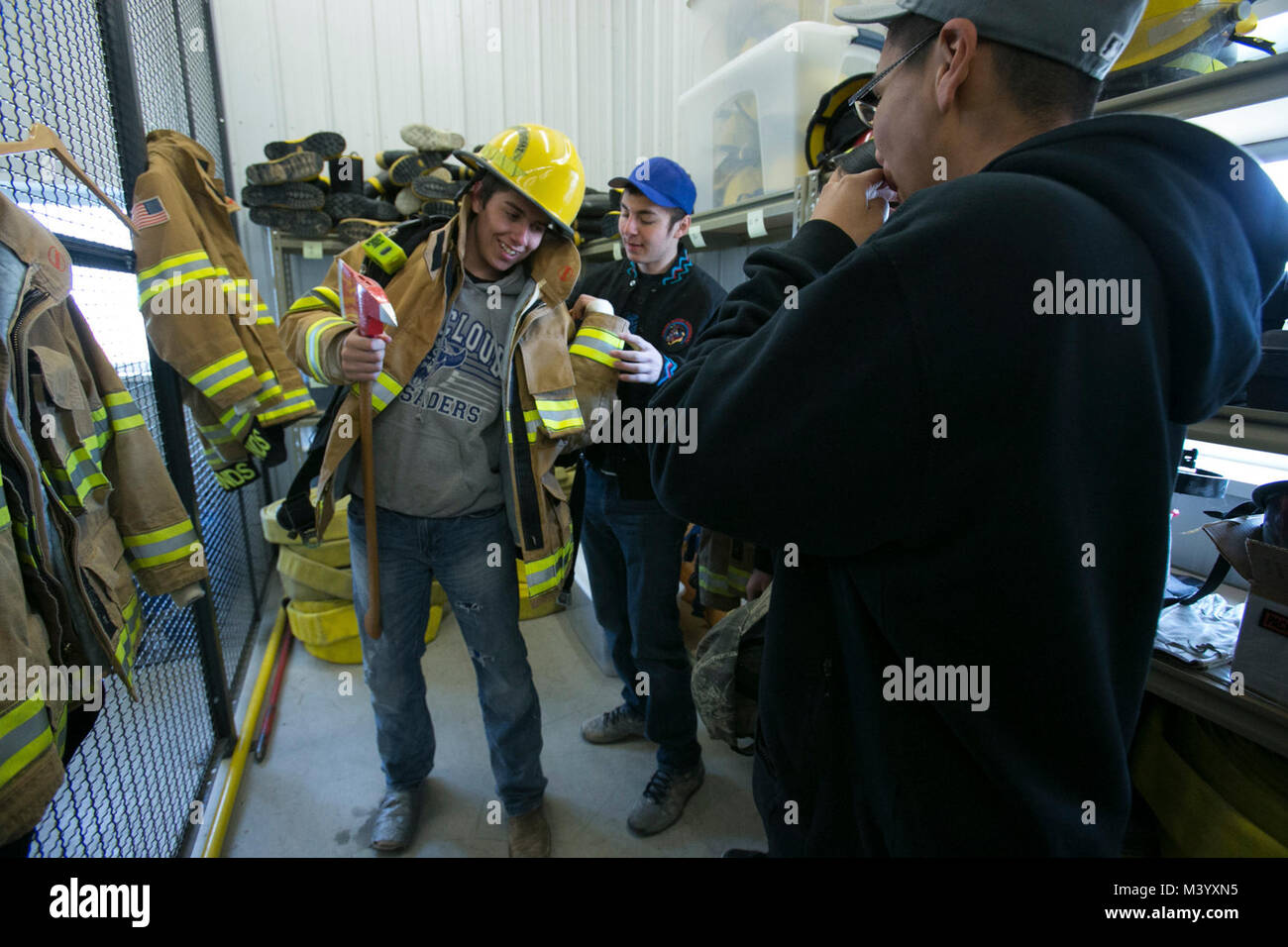Trying on Firefighting Gear Stock Photo - Alamy