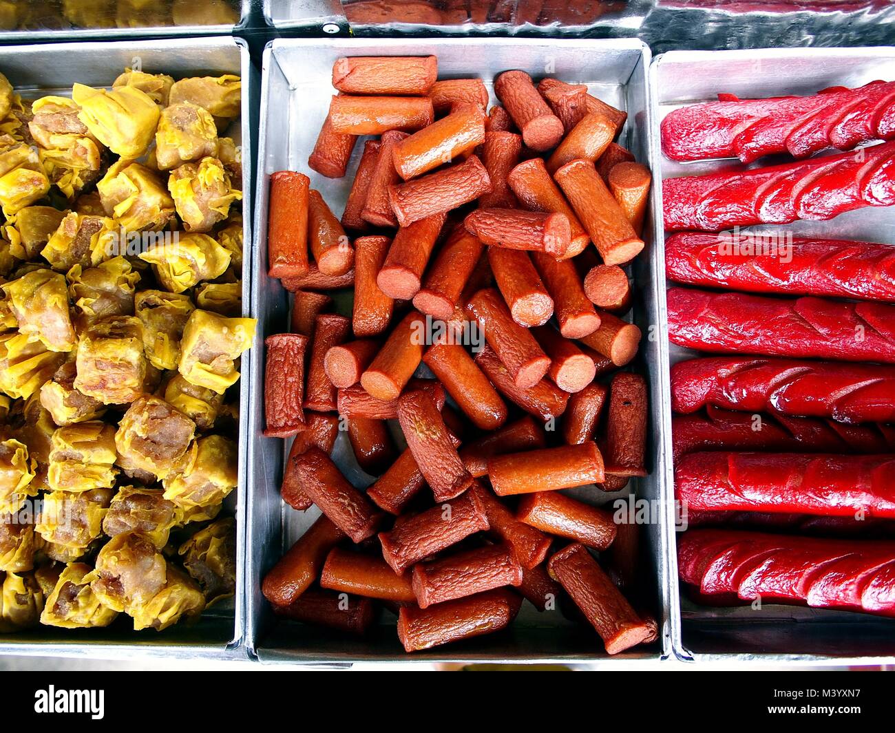 Photo of assorted snack food items sold at a street food kiosk Stock ...