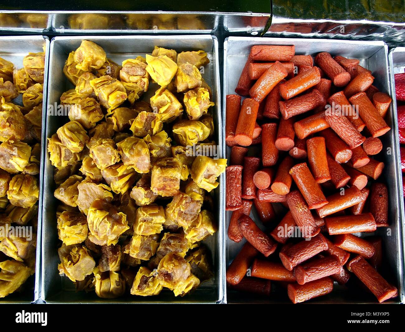 Photo of assorted snack food items sold at a street food kiosk Stock ...