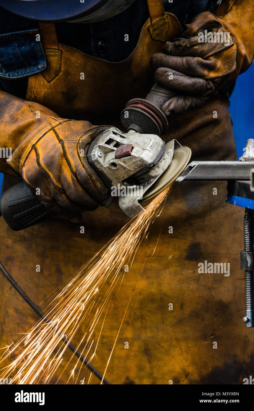 worker cutting iron with his tool Stock Photo - Alamy
