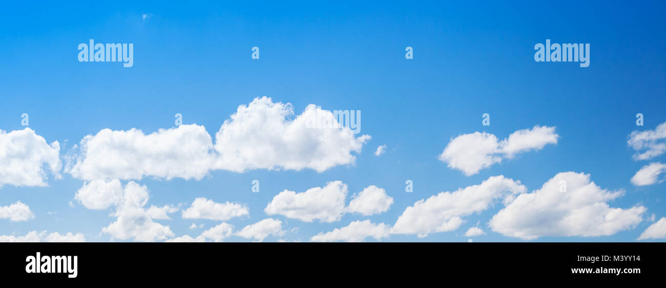 Wide blue sky, panoramic background photo, white cumulus clouds ...
