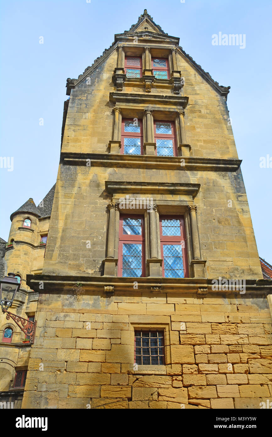 Ornate and narrow gable in a medieval house with leadlight windows ...