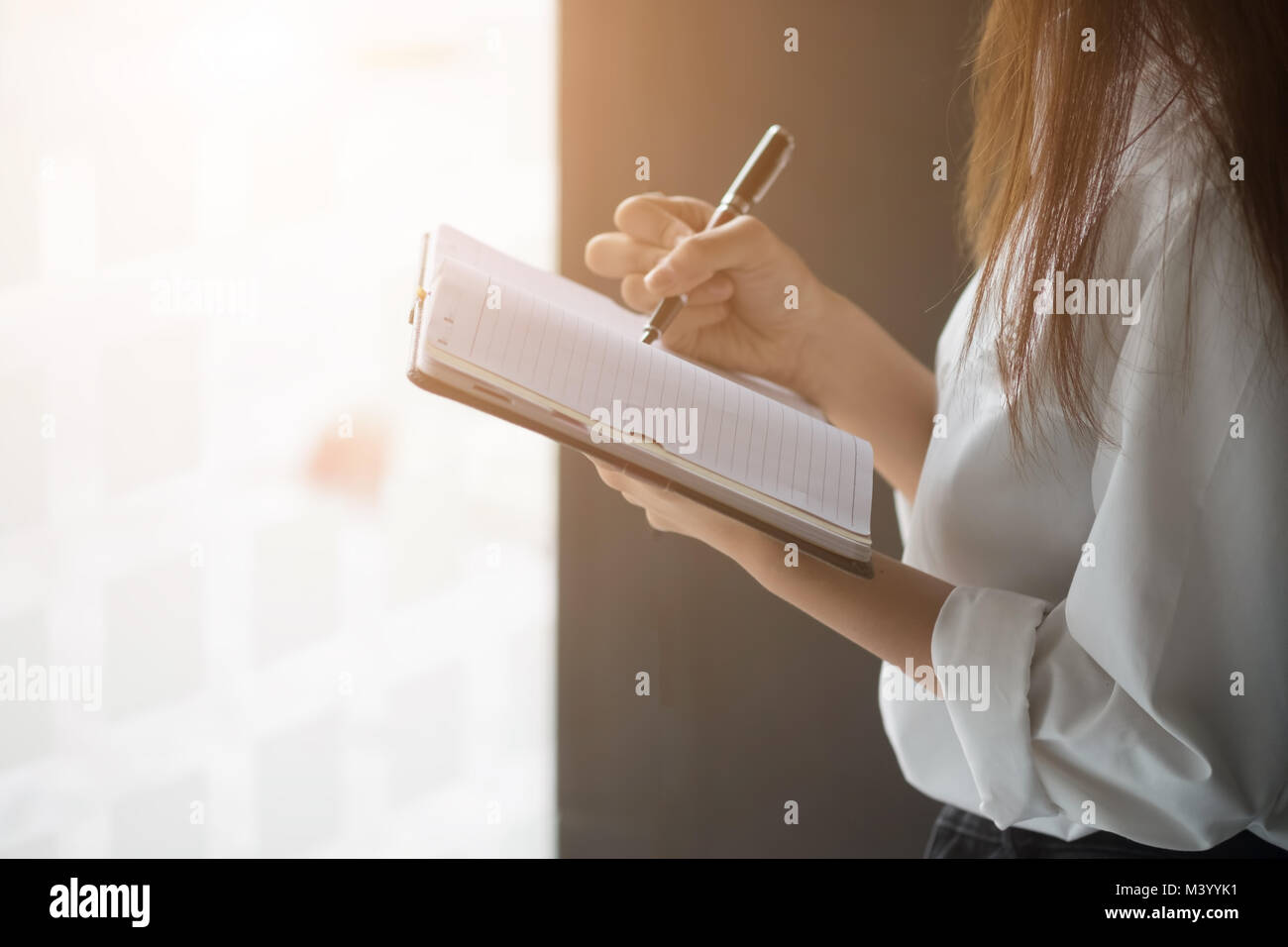 woman writing paper with vintage tone Stock Photo - Alamy