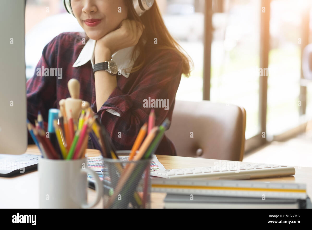 Graphic designer working on creative desk computer while using graphic ...