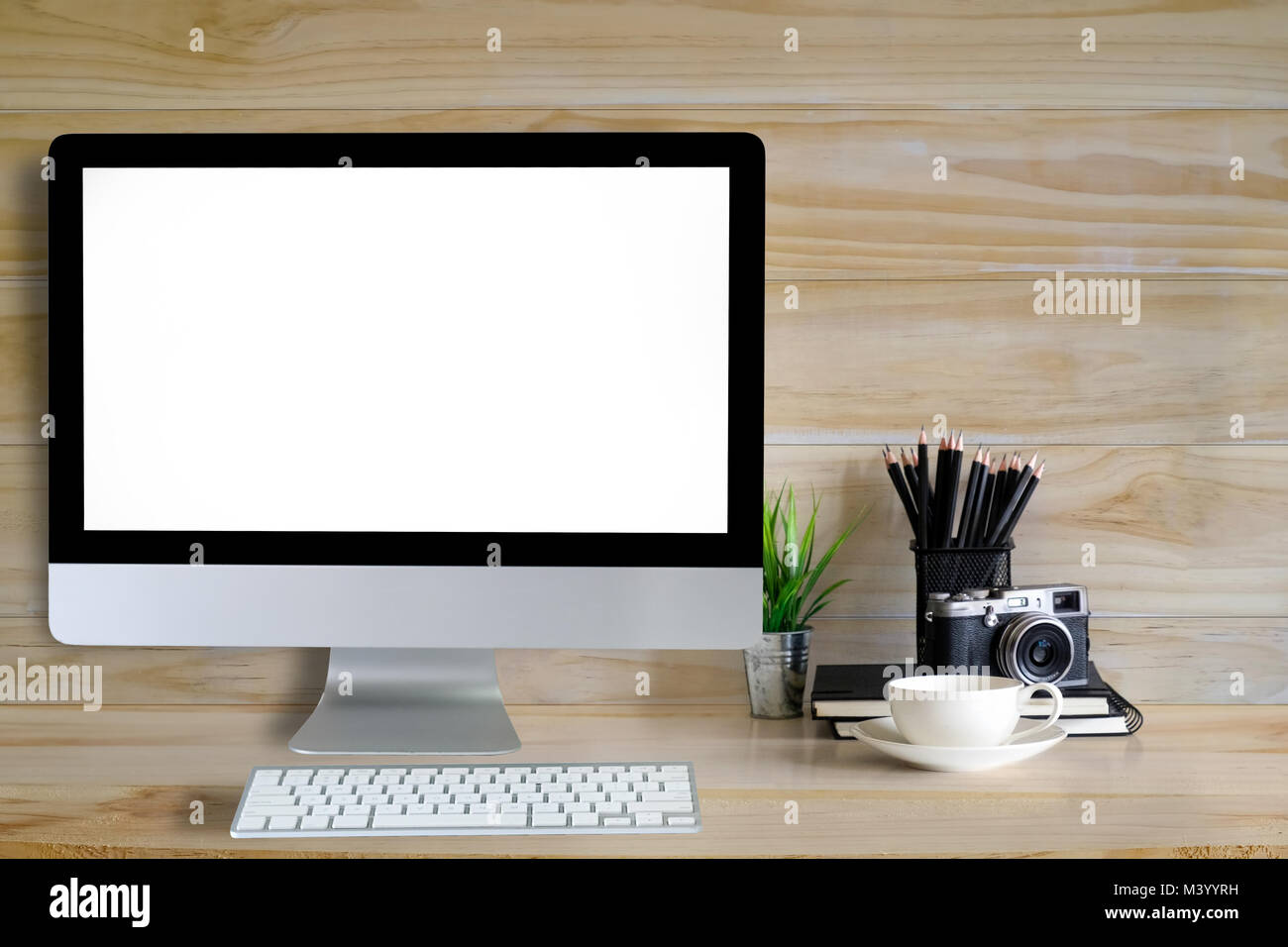 Computer mockup with creative desk empty screen display Stock Photo - Alamy