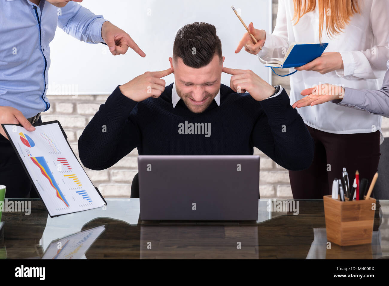 Angry Business People Pointing At Male Colleague During Meeting In ...