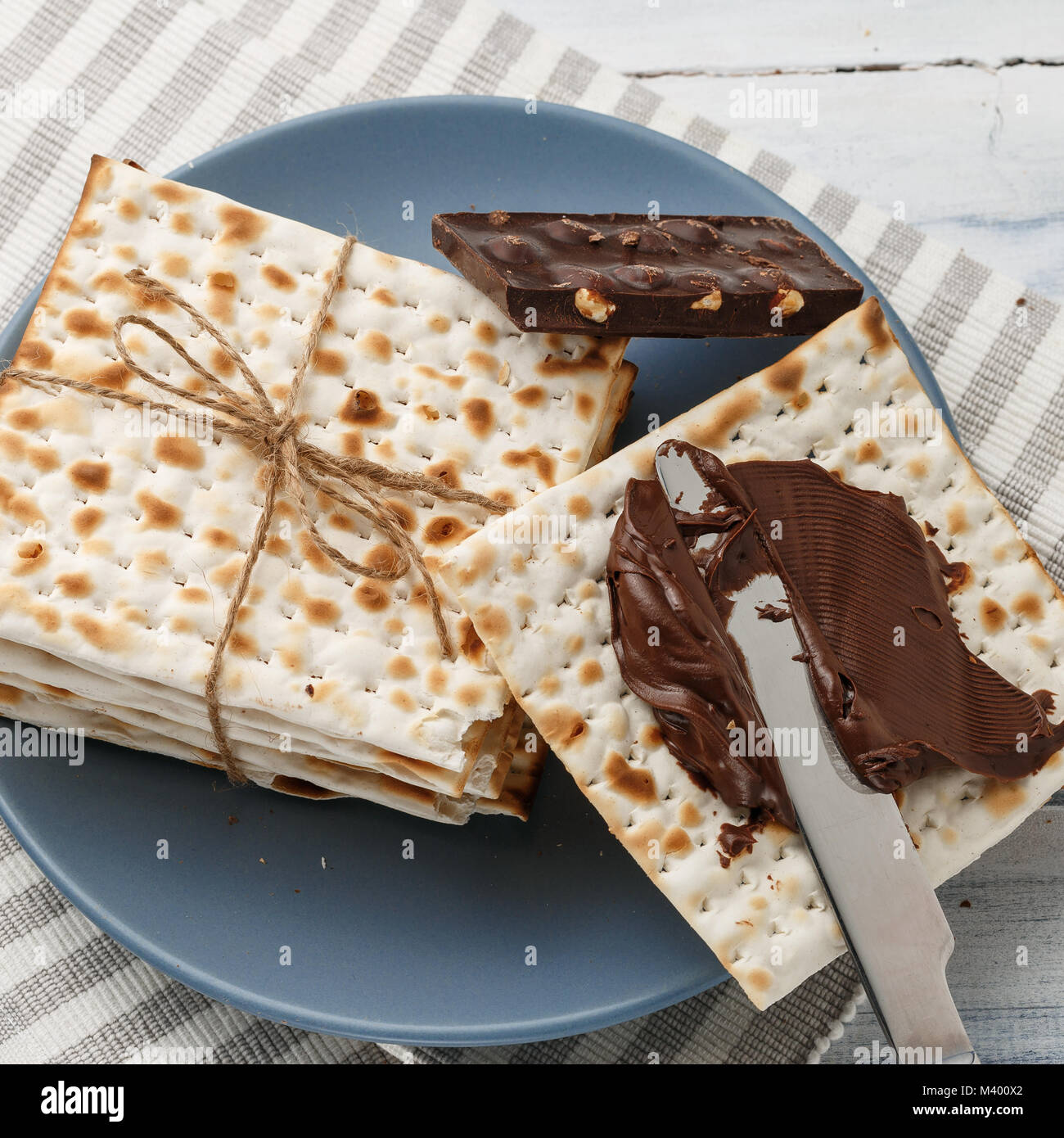 Jewish matzah bread with chocolate cream and knife. Tasty snack for ...