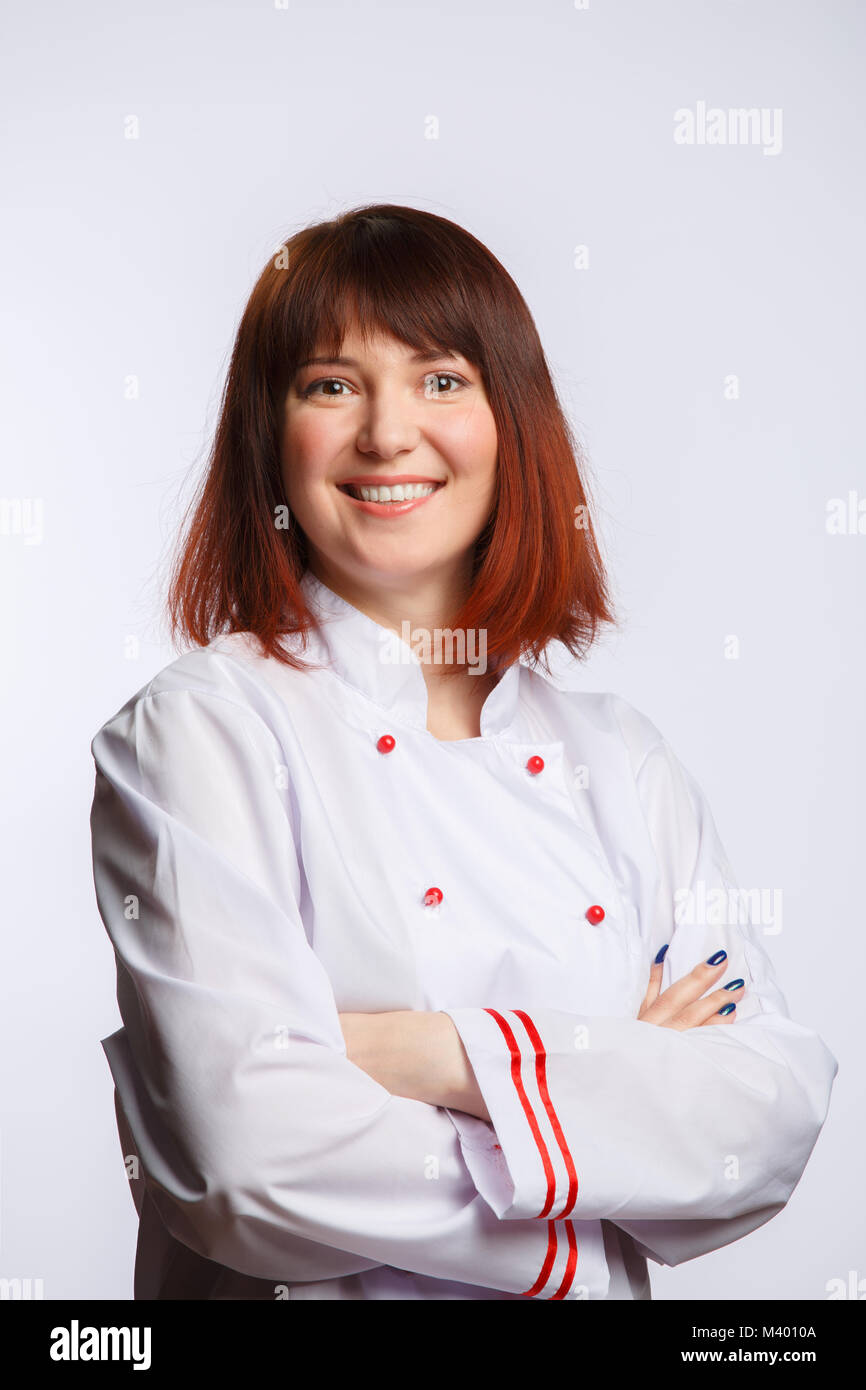 Image of female chef in white robe on empty background Stock Photo - Alamy