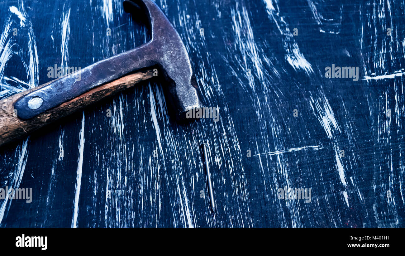 Hammer to repair lying on a wooden table. Men's housework. Worki Stock ...