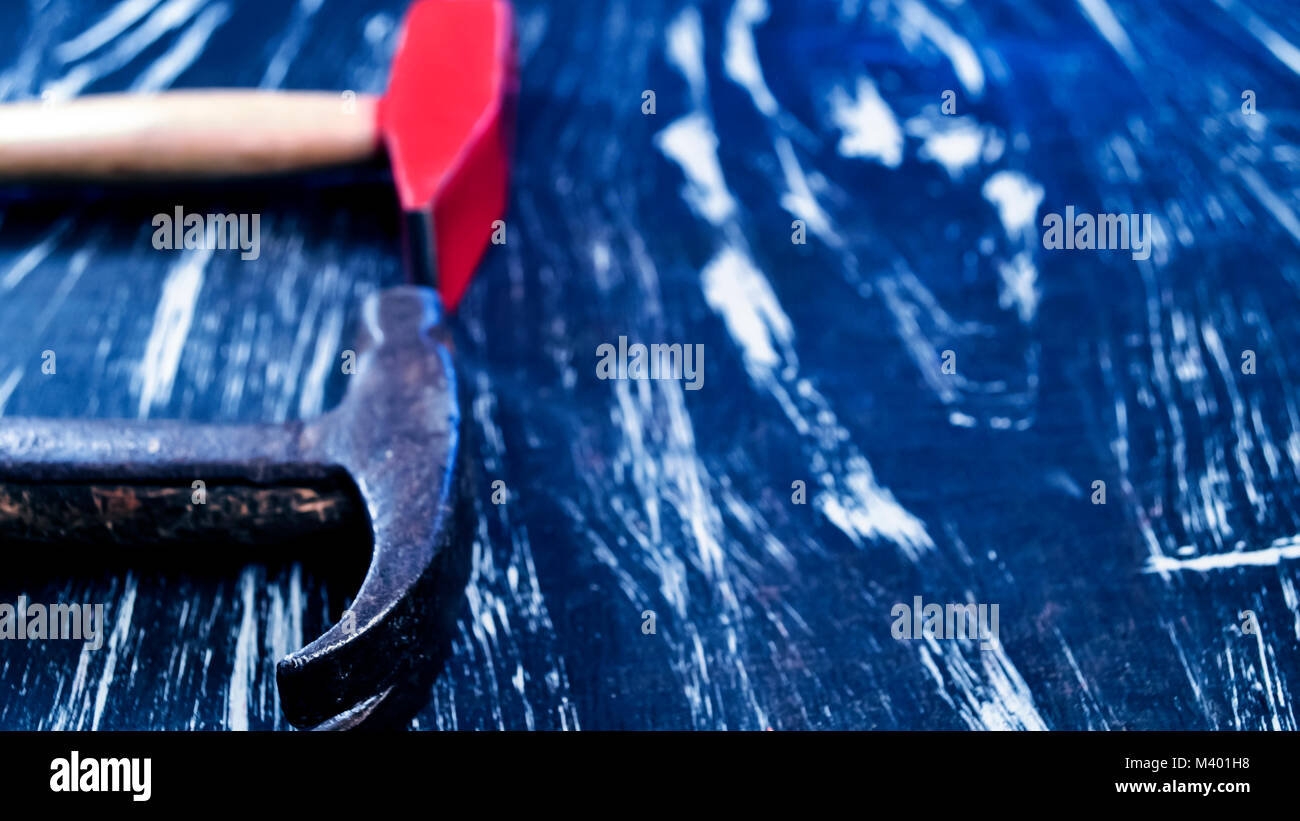 Hammer to repair lying on a wooden table. Men's housework. Worki Stock ...