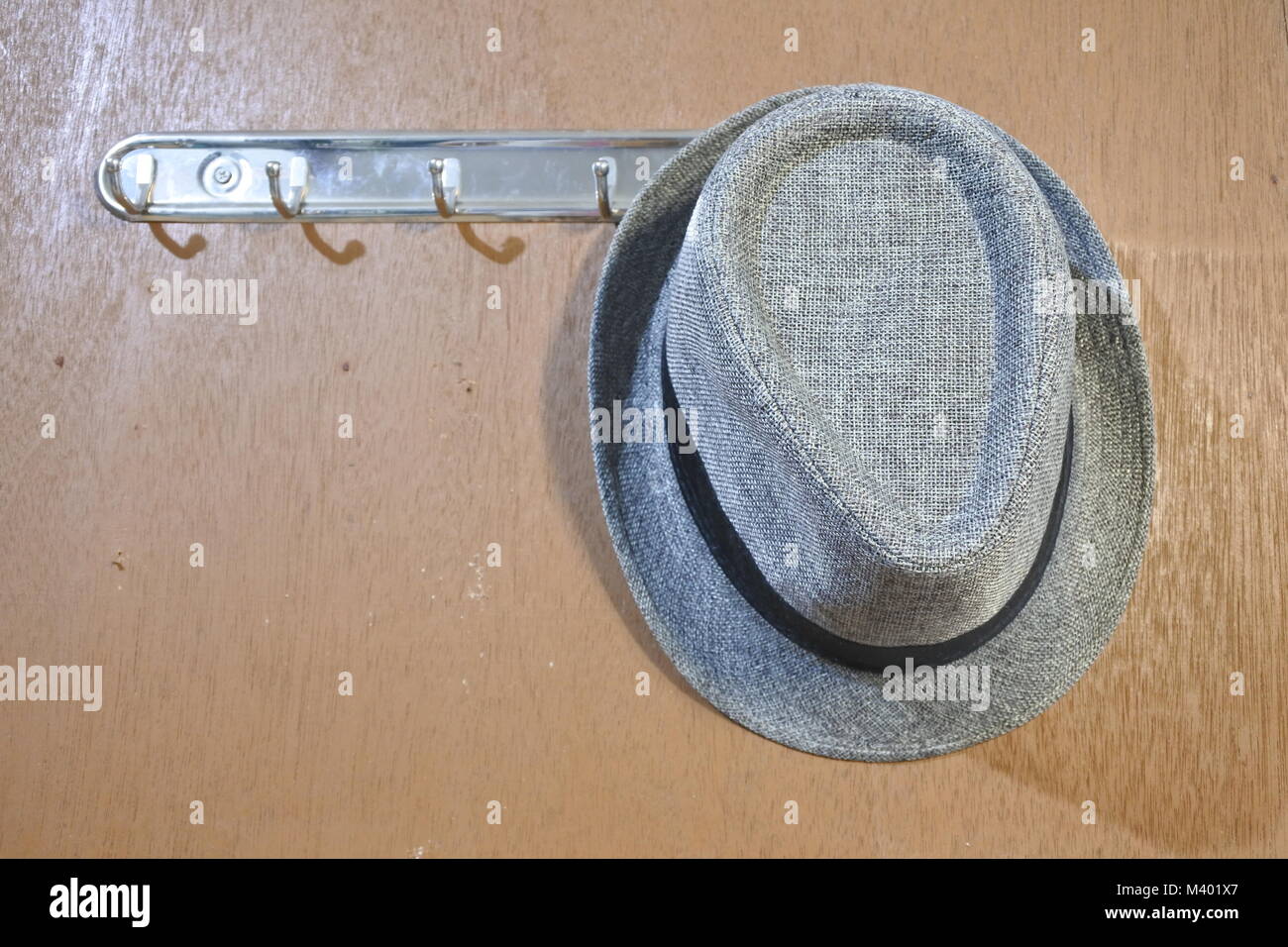 A vintage hat hanged by the door Stock Photo - Alamy