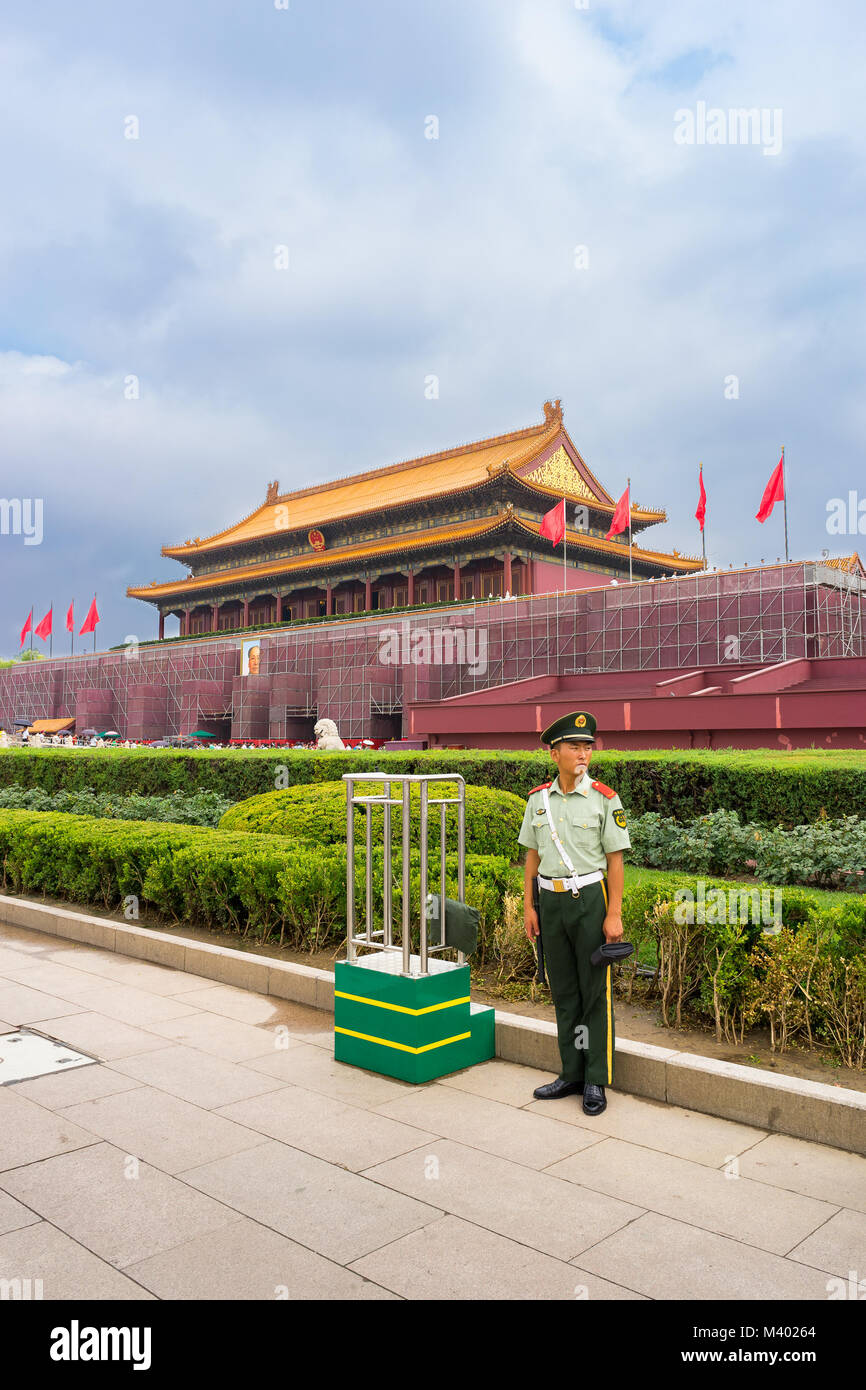 Beijing, China - A guard in front of the entrance to the Forbidden city ...