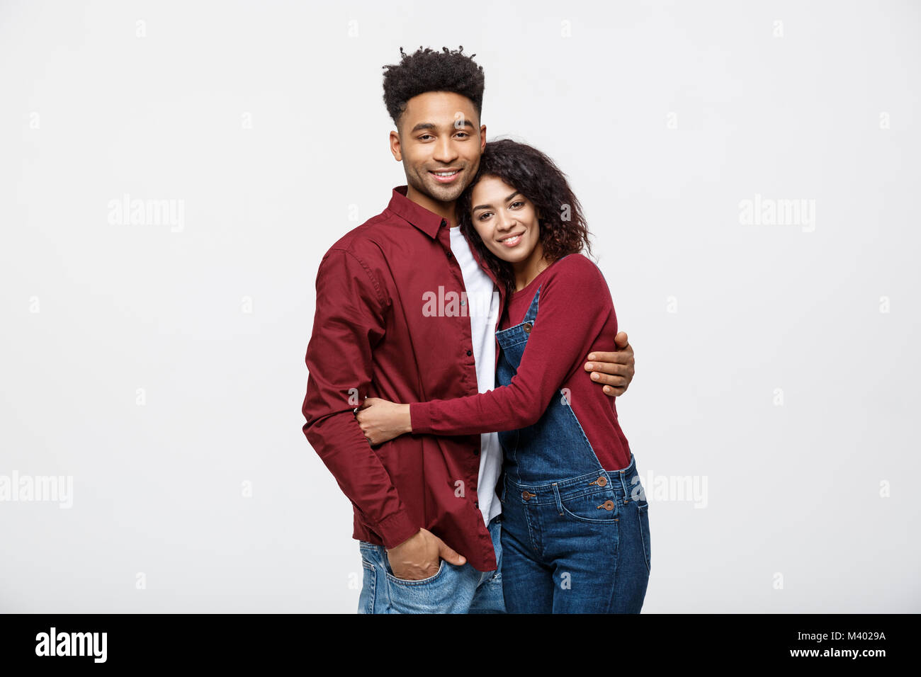 portrait of happy african american couple hug each other on white ...