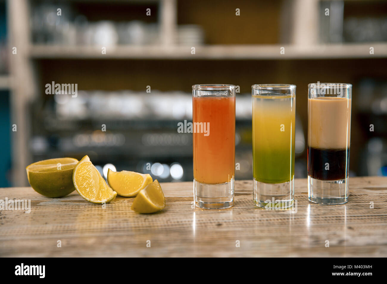 A composition of three different colorful shot drinks. Alcoholic ...