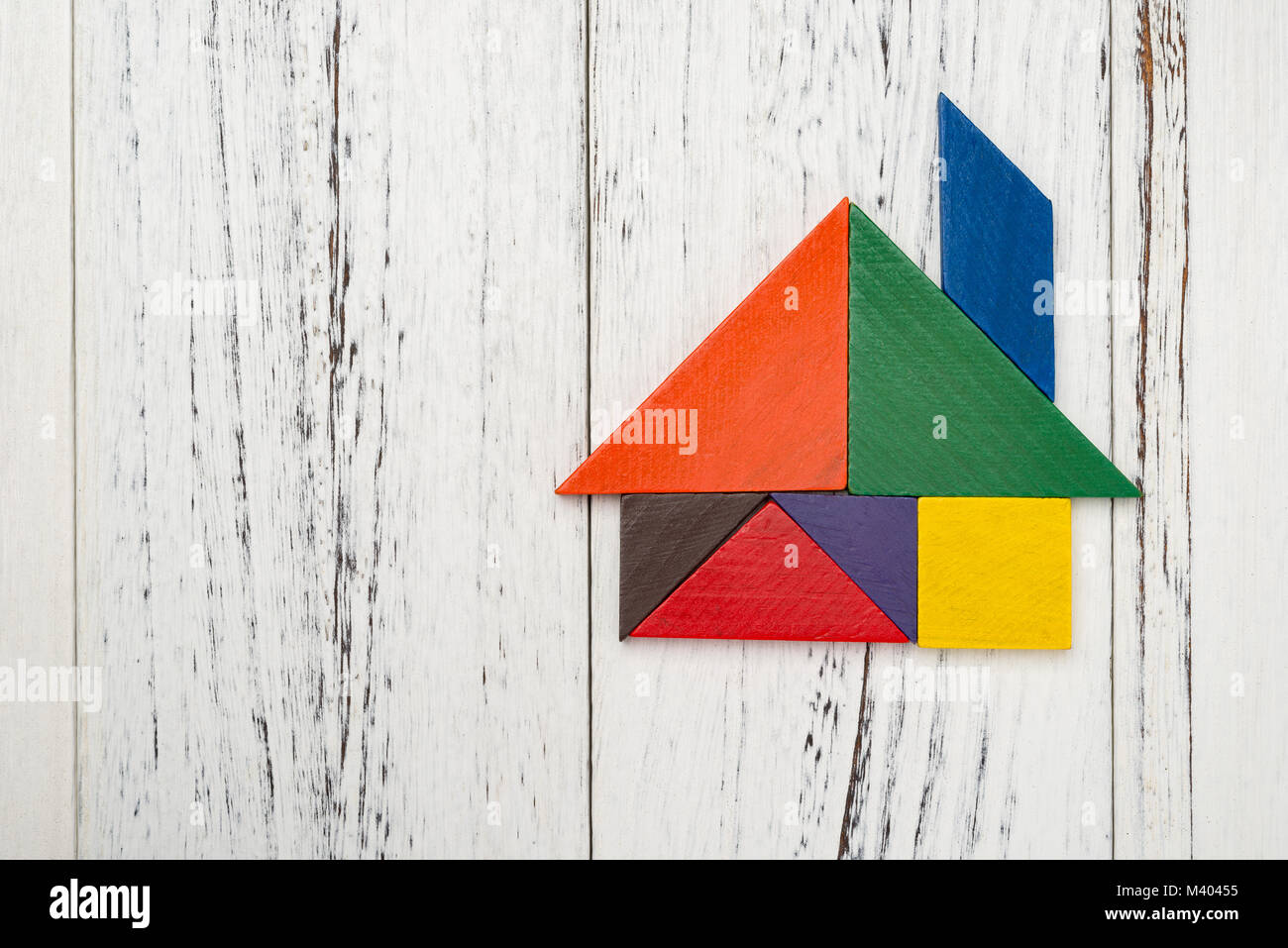 wooden tangram shaped like a house with copy space Stock Photo - Alamy