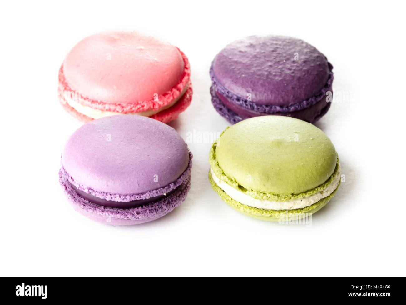 four french macarons isolated on white background Stock Photo - Alamy
