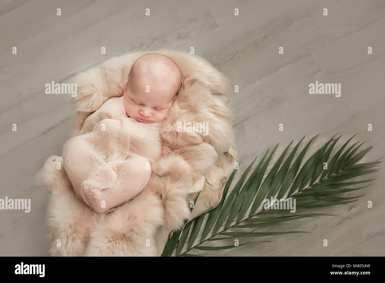 Sleeping newborn baby boy swaddled in a blanket Stock Photo - Alamy
