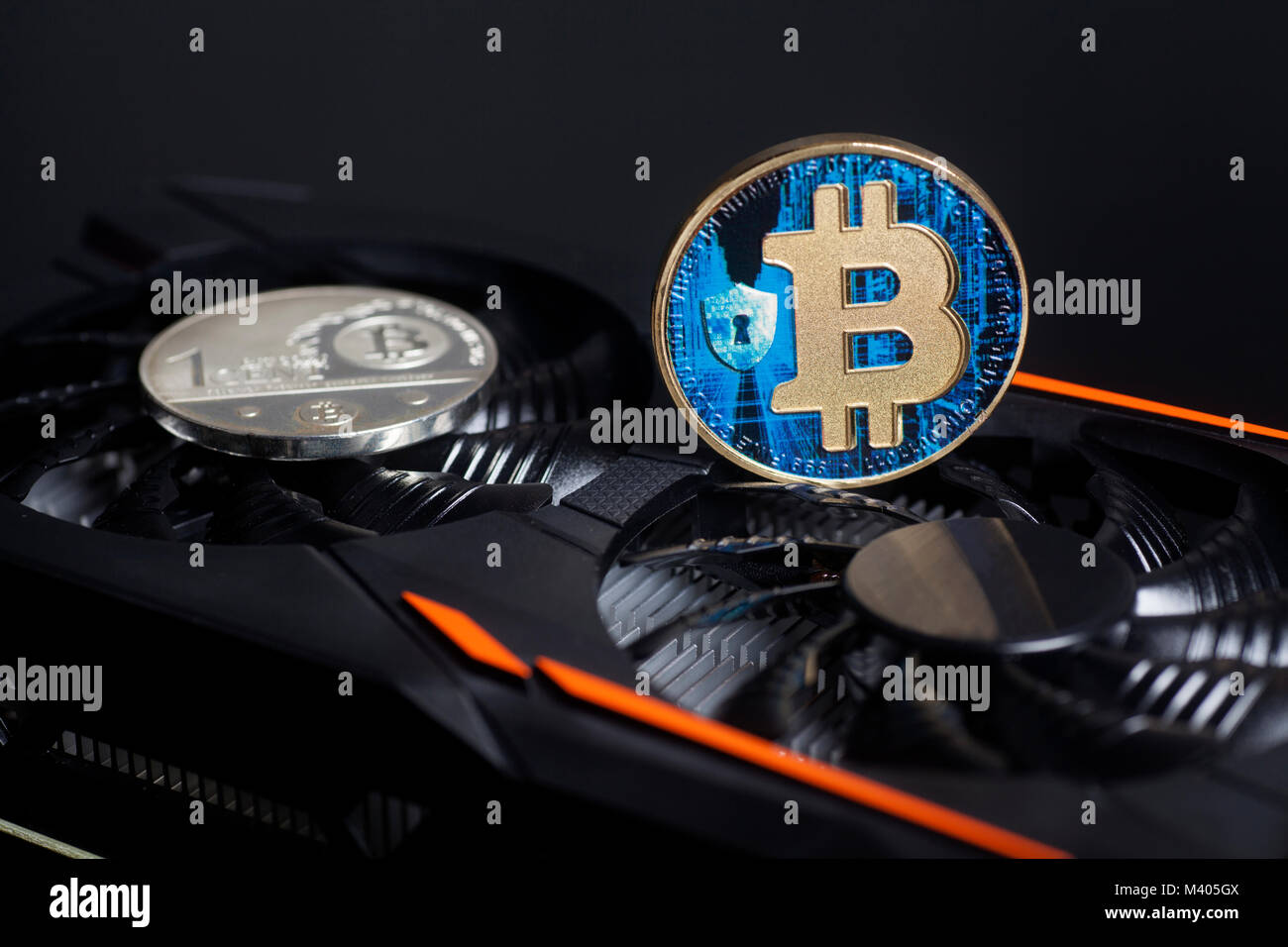 Cryptocurrency mining concept with bitcoins on a computer video card on ...