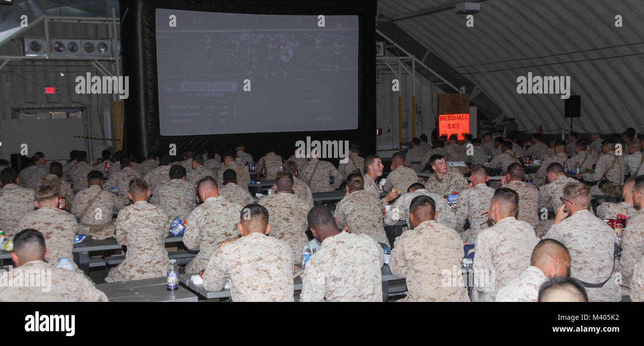 Marines and sailors watch Super Bowl LII on a large screen television ...