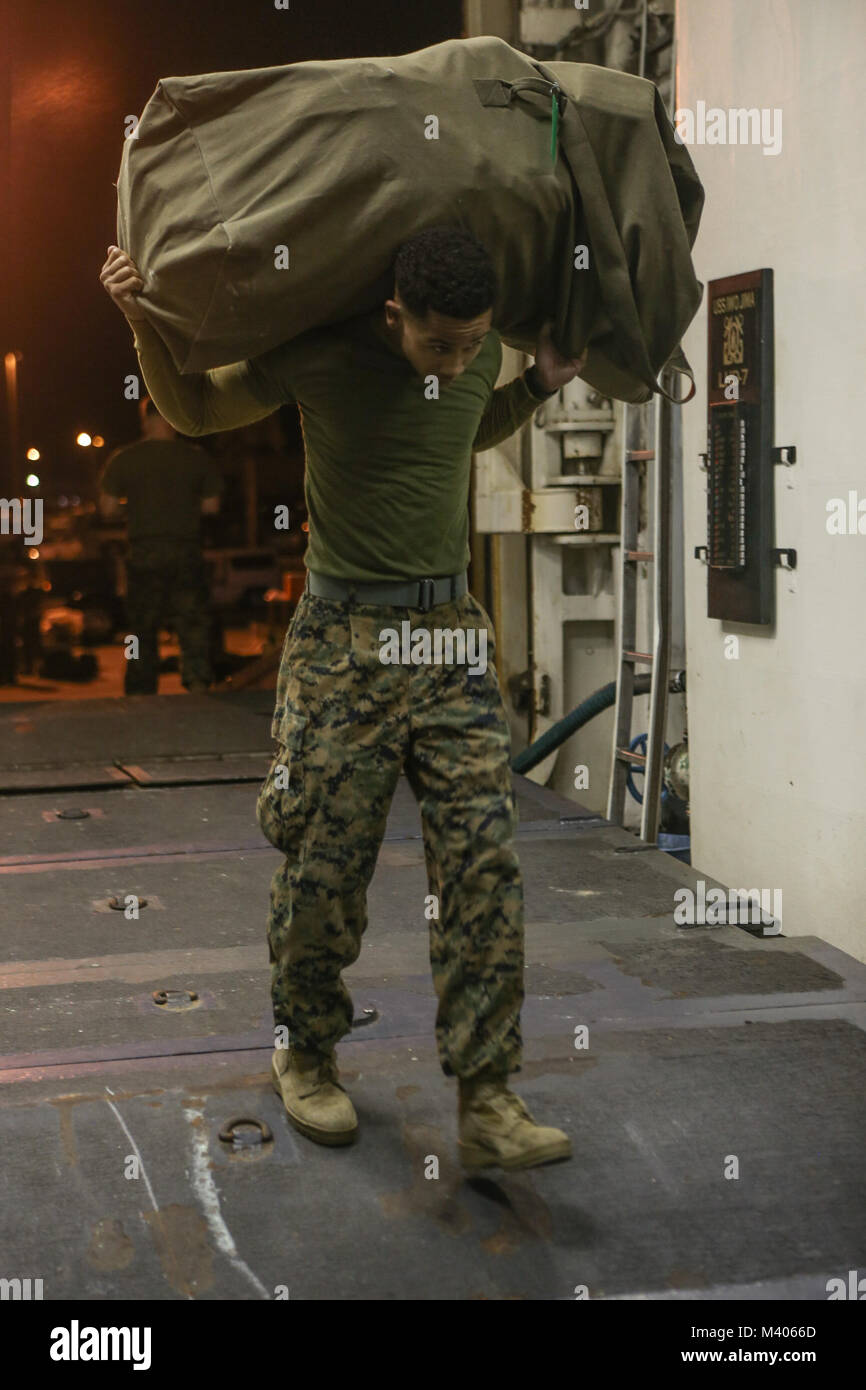 A U.S. Marine with the 26th Marine Expeditionary Unit (MEU), carries ...