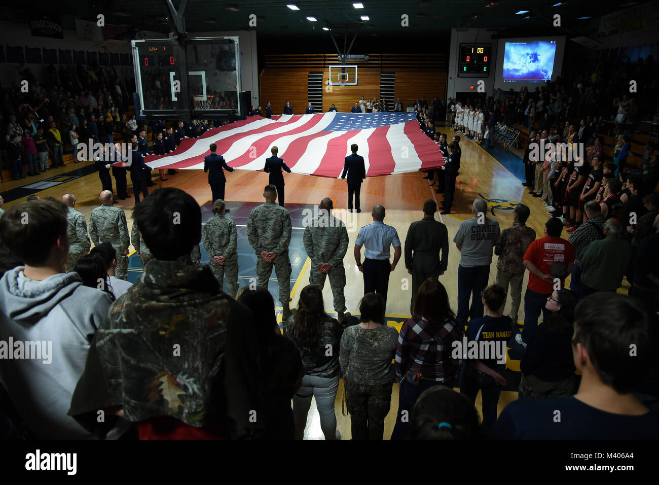 Henley High School Junior ROTC members unfurl the U.S. Flag during a ...