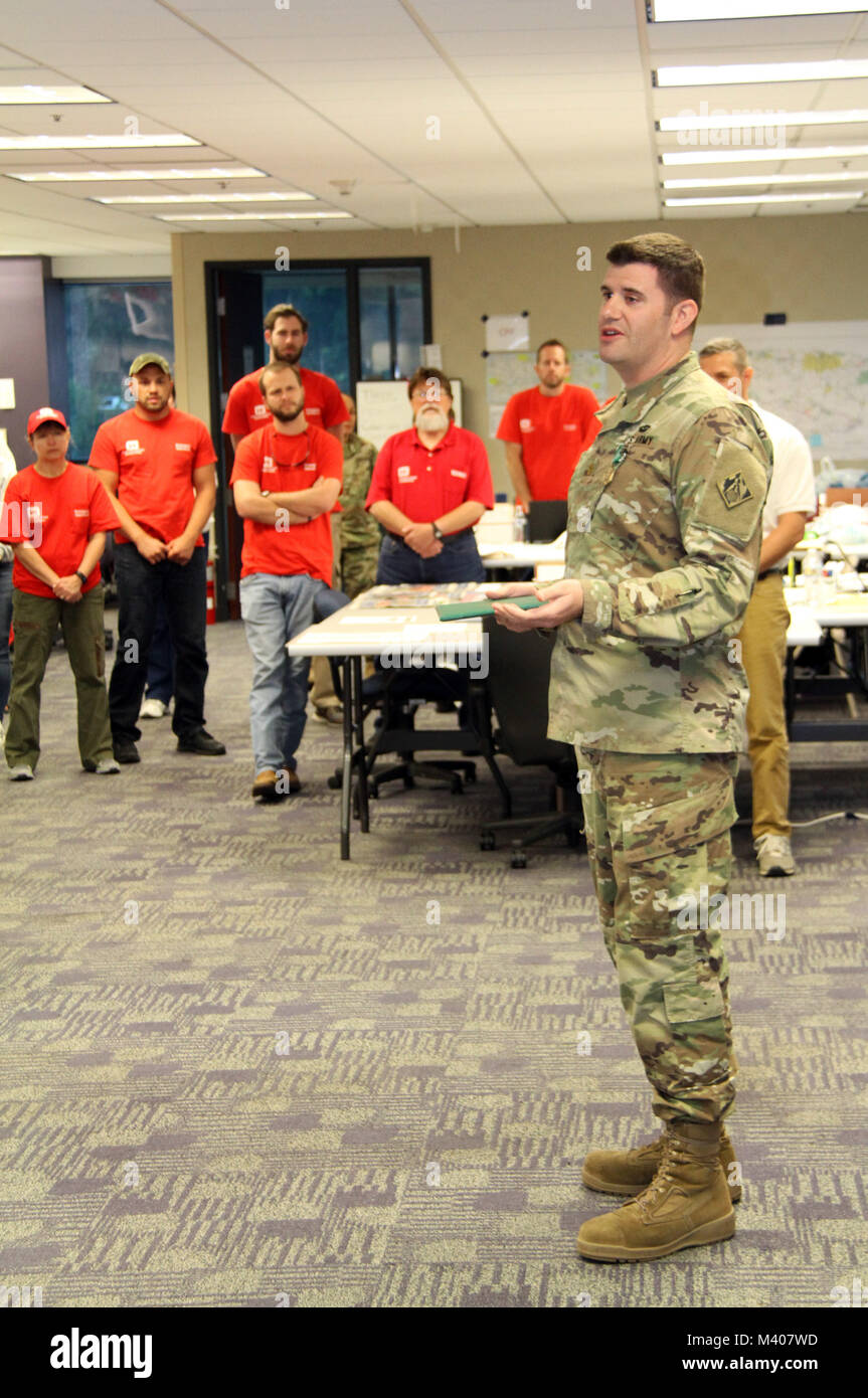 Maj. Mark Crimaldi (right) makes final remarks after receiving the Army ...