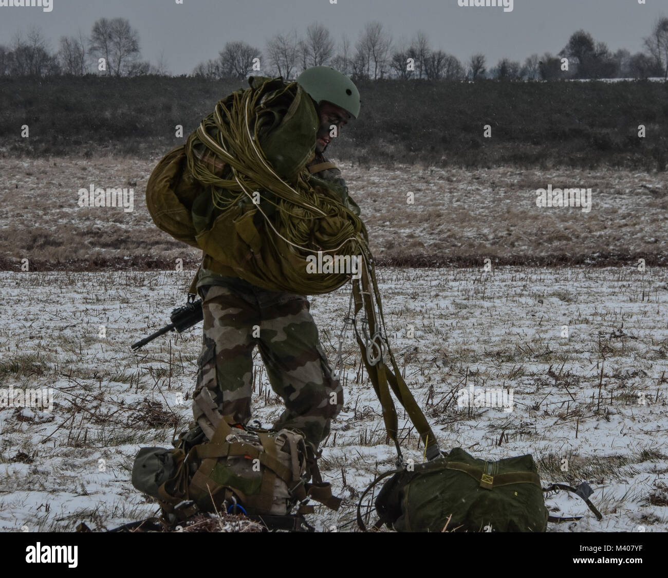 A paratrooper from the French 11th Airborne Brigade recovers his ...