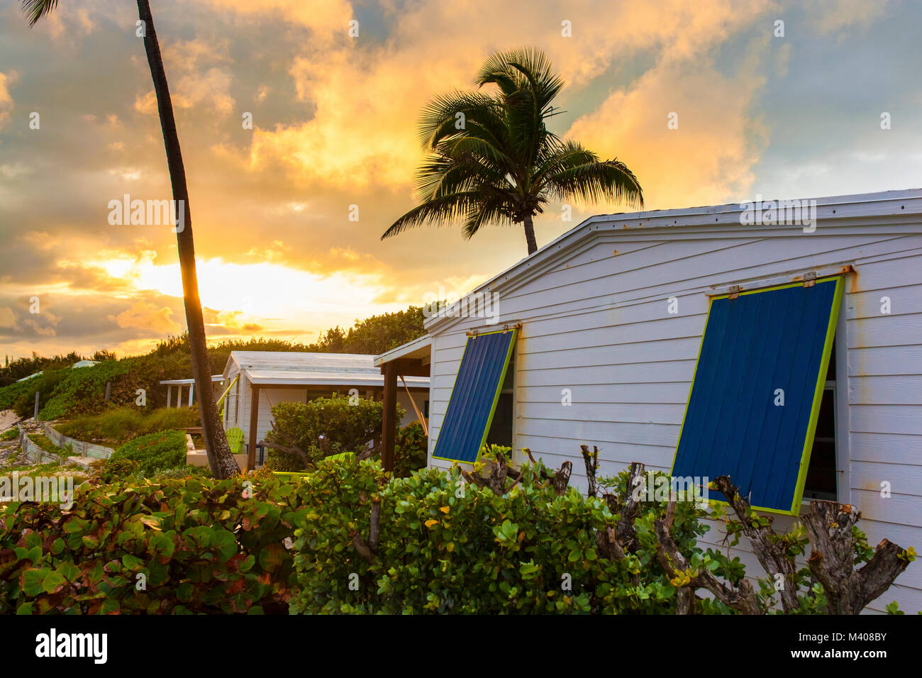 beach cottage in the tropics with perfect sunset Stock Photo - Alamy