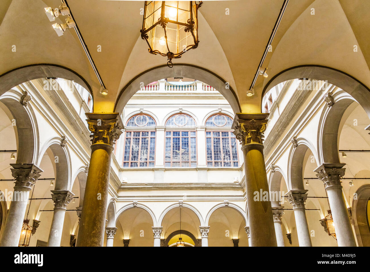 Beautiful interior courtyard with columns and lights in Florence Stock ...