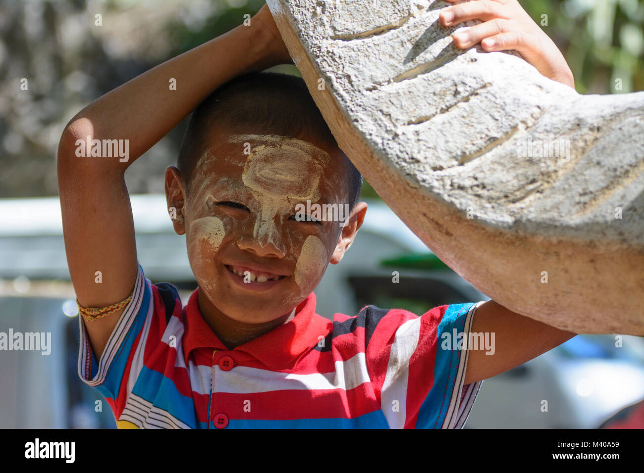 Hpa-An: boy, face with thanaka cosmetic paste, , Kayin (Karen) State ...