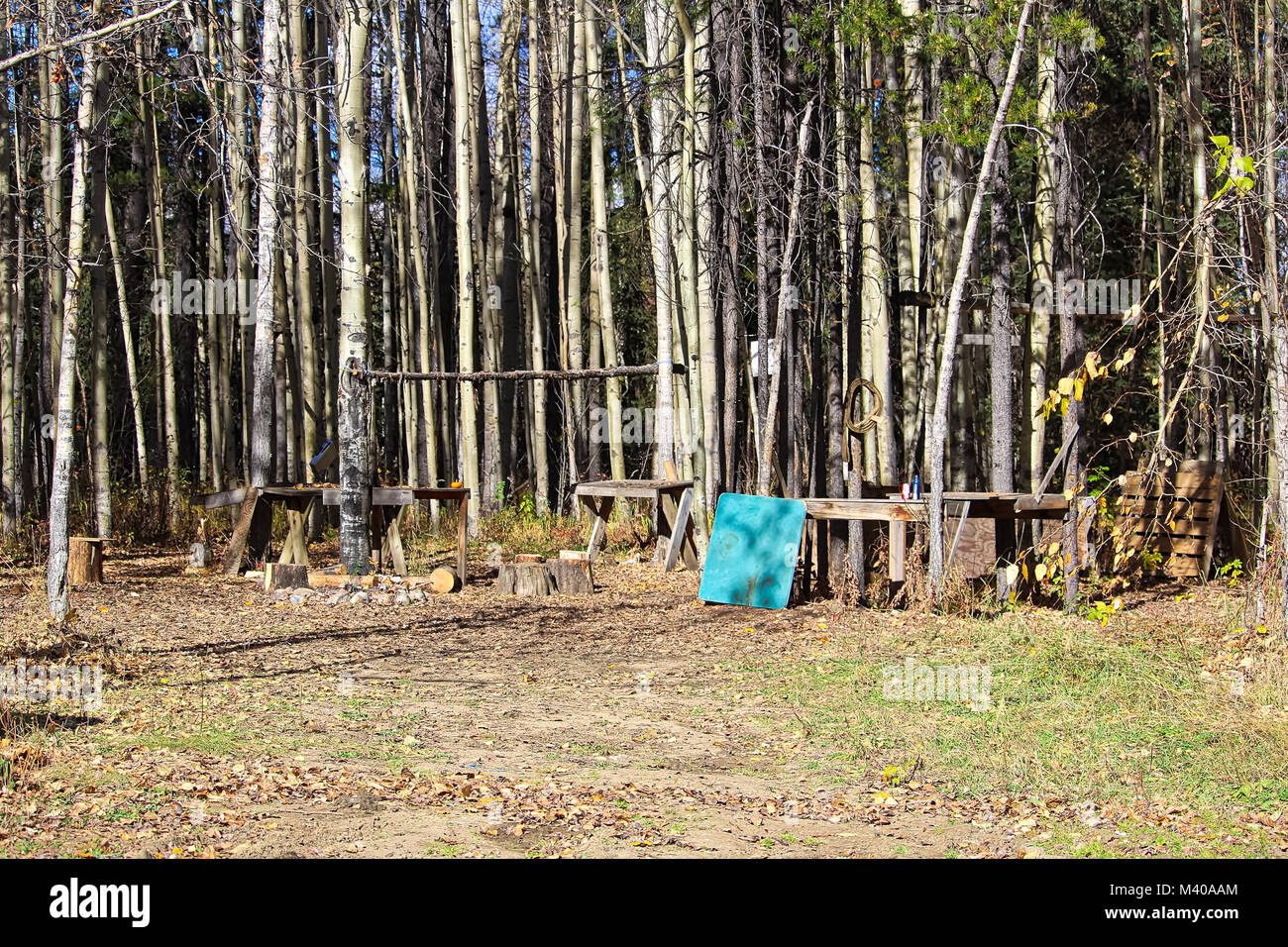 Tables and poles setup at a popular hunting camp spot Stock Photo - Alamy