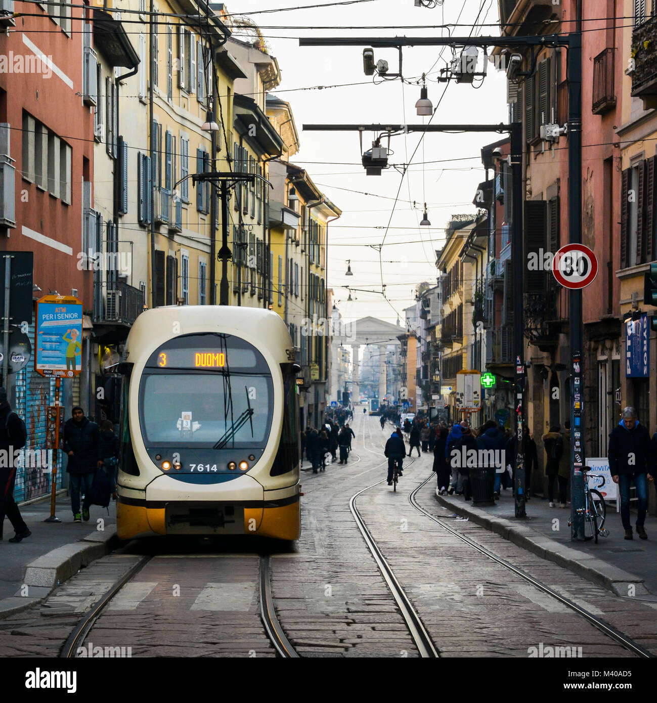 Milan, Italy - Feb 11, 2018: Yellow Milanese tram at busy street in the ...