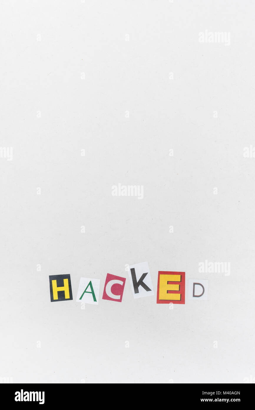 Hacked / Ransomware cutout letters message on sheet of plain newsprint ...