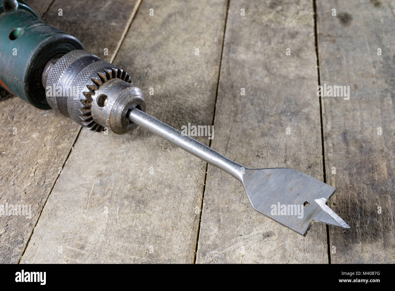 Joinery tools in a workshop. Drill, hammer and other tools on a wooden ...