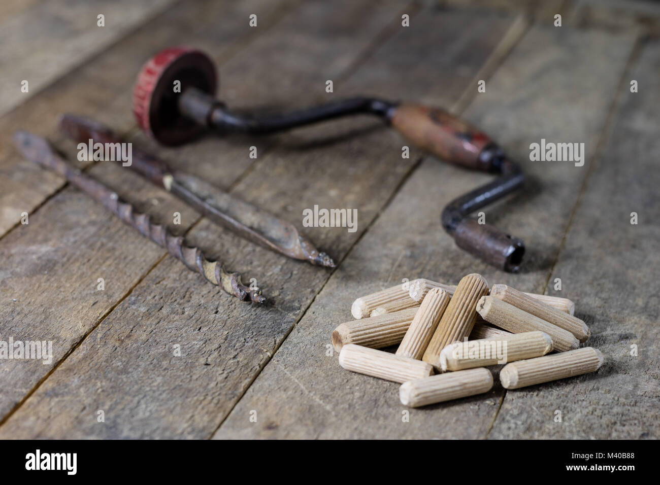 Joinery tools in a workshop. Drill, hammer and other tools on a wooden ...