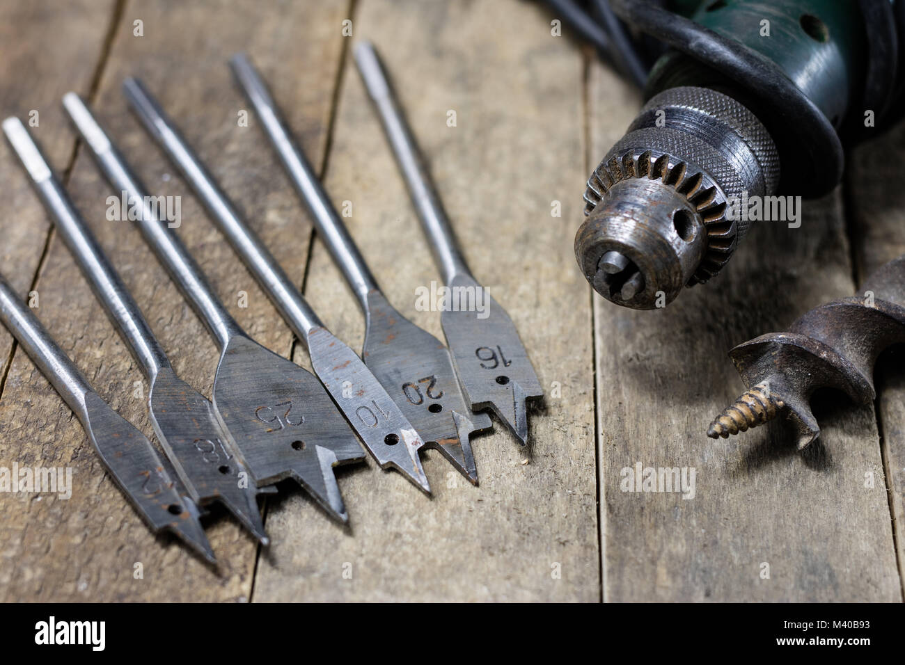 Joinery tools in a workshop. Drill, hammer and other tools on a wooden ...