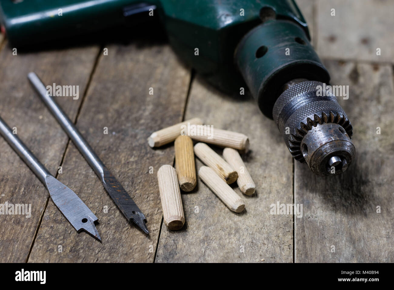 Joinery tools in a workshop. Drill, hammer and other tools on a wooden ...