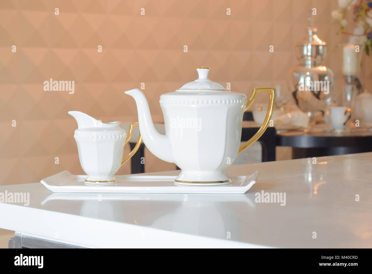 White ceramic tea set on white top dining table Stock Photo - Alamy