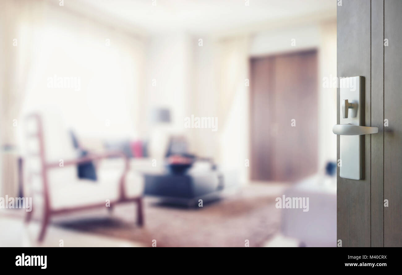 opened wooden door to modern living room interior Stock Photo - Alamy