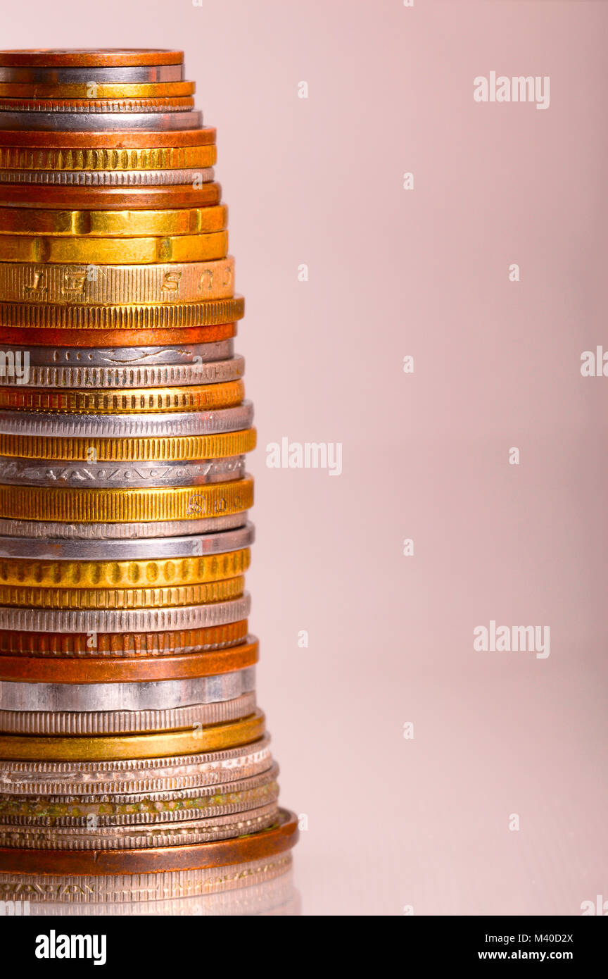 Vertical photo of coins stacked Stock Photo - Alamy