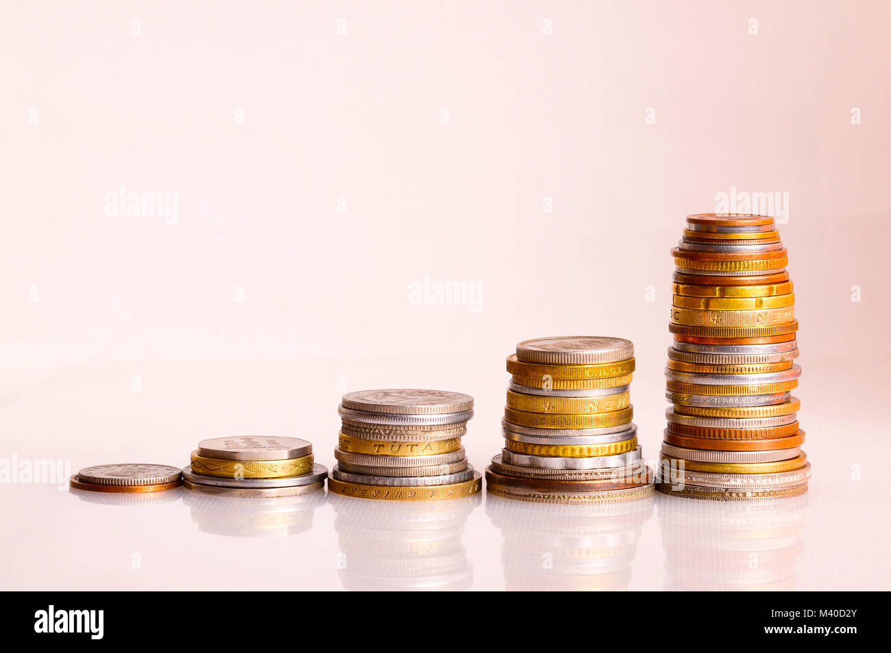 Graph rising with coins bars Stock Photo - Alamy