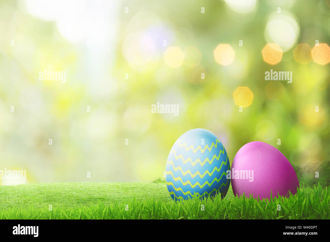Two easter eggs on green grass lawn with blur background Stock Photo ...