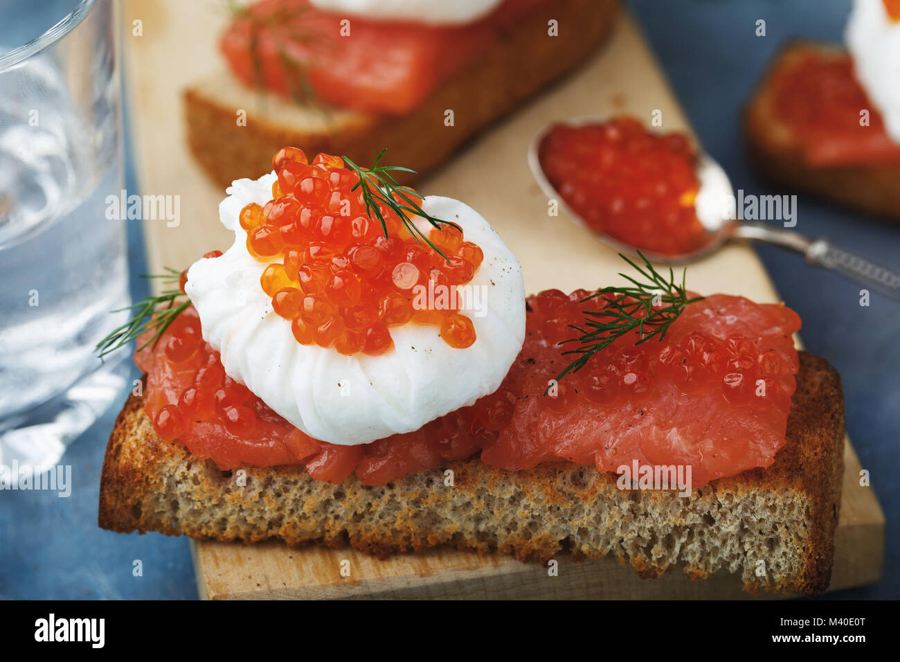 Sunday breakfast with poached egg, caviar and red fish Stock Photo - Alamy