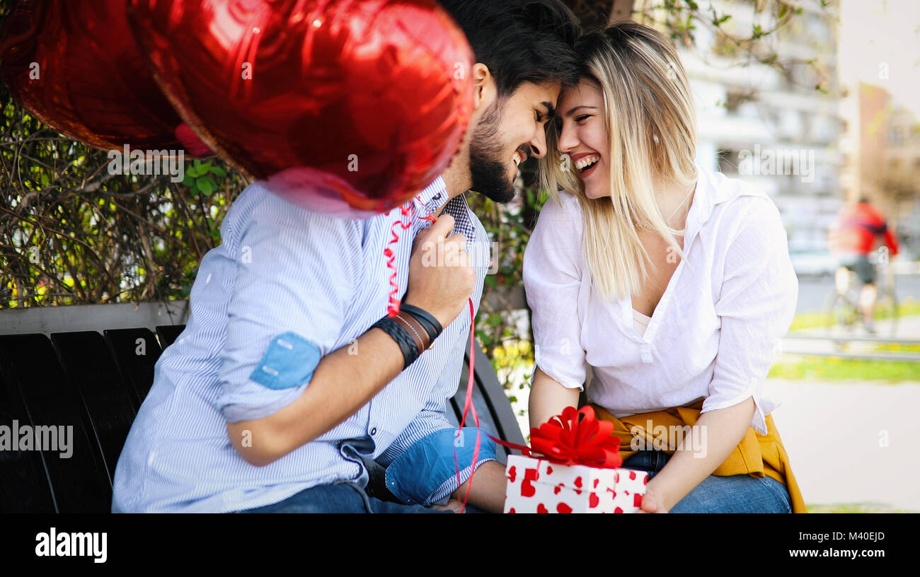 Picture of romantic couple standing outside with baloons Stock Photo ...