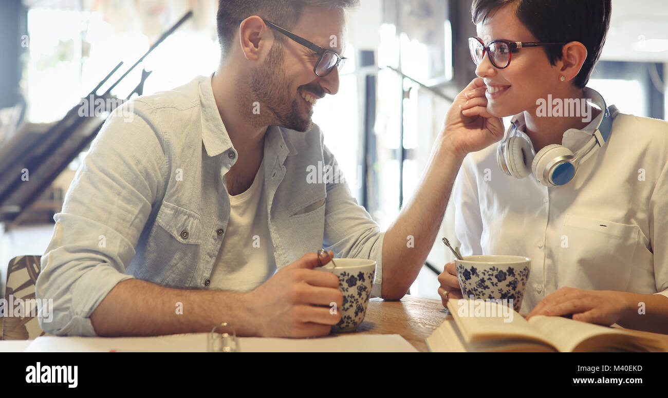 Students couple in school studying for exams together Stock Photo - Alamy