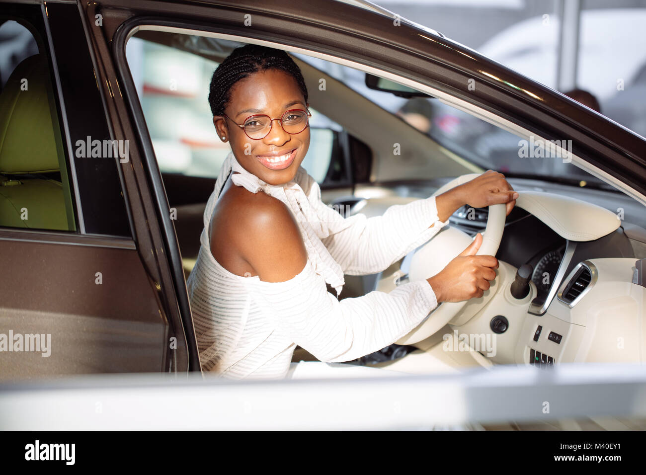 Happy young african female driver hi-res stock photography and images ...
