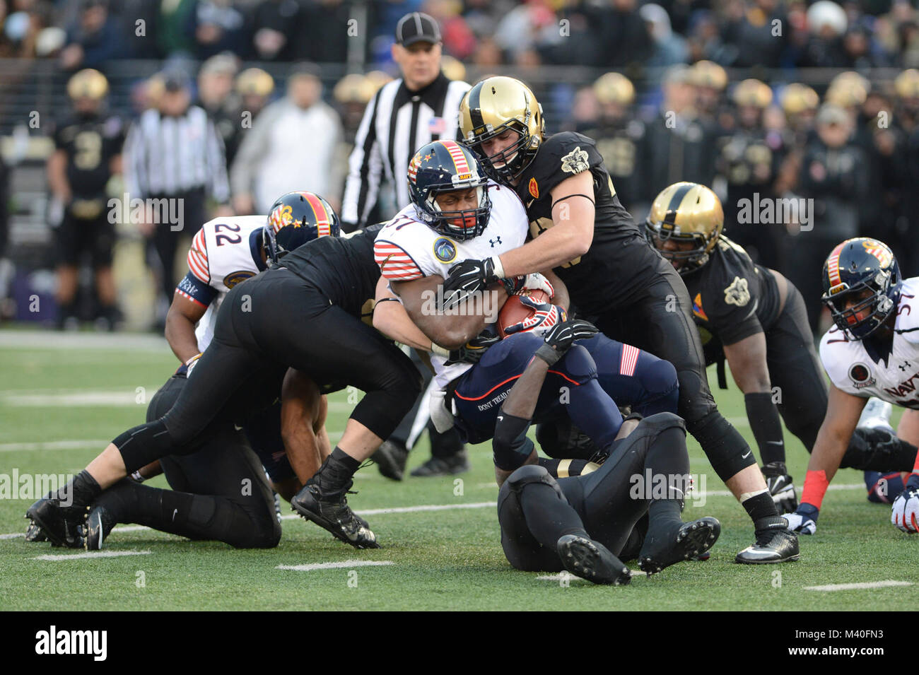 141213-D-FW736-046 –Navy fullback Chris Swain is tackled by the Army ...