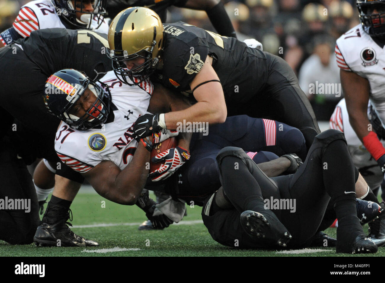 Army linebacker James Kelly tackles Navy running back Chris Swan during ...