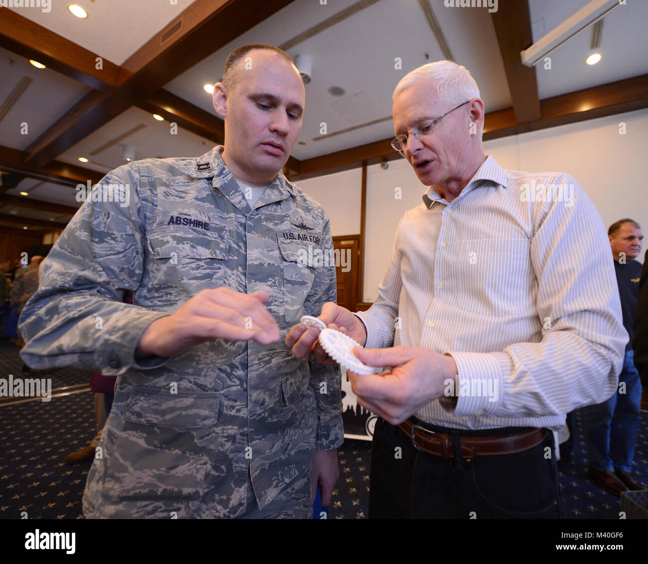 U.S. Air Force Captain Jason Abshire (Left), a cyber-engineer, and Mr ...