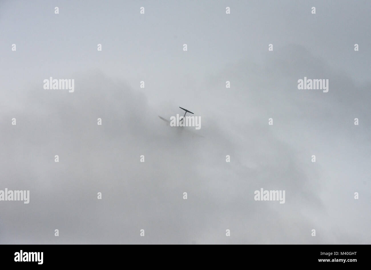 A C-5 Galaxy from Dover Air Force Base, Delaware, flies into the clouds ...